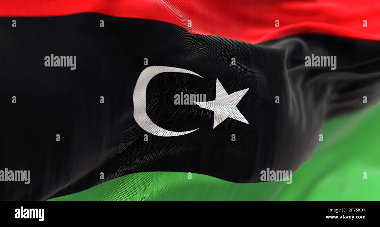 Detail of the Libya national flag fluttering. Three horizontal bands ...