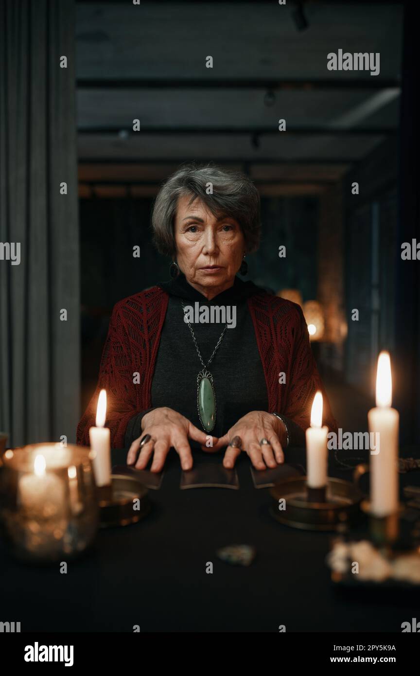 Mature witch holding spell hi-res stock photography and images - Alamy