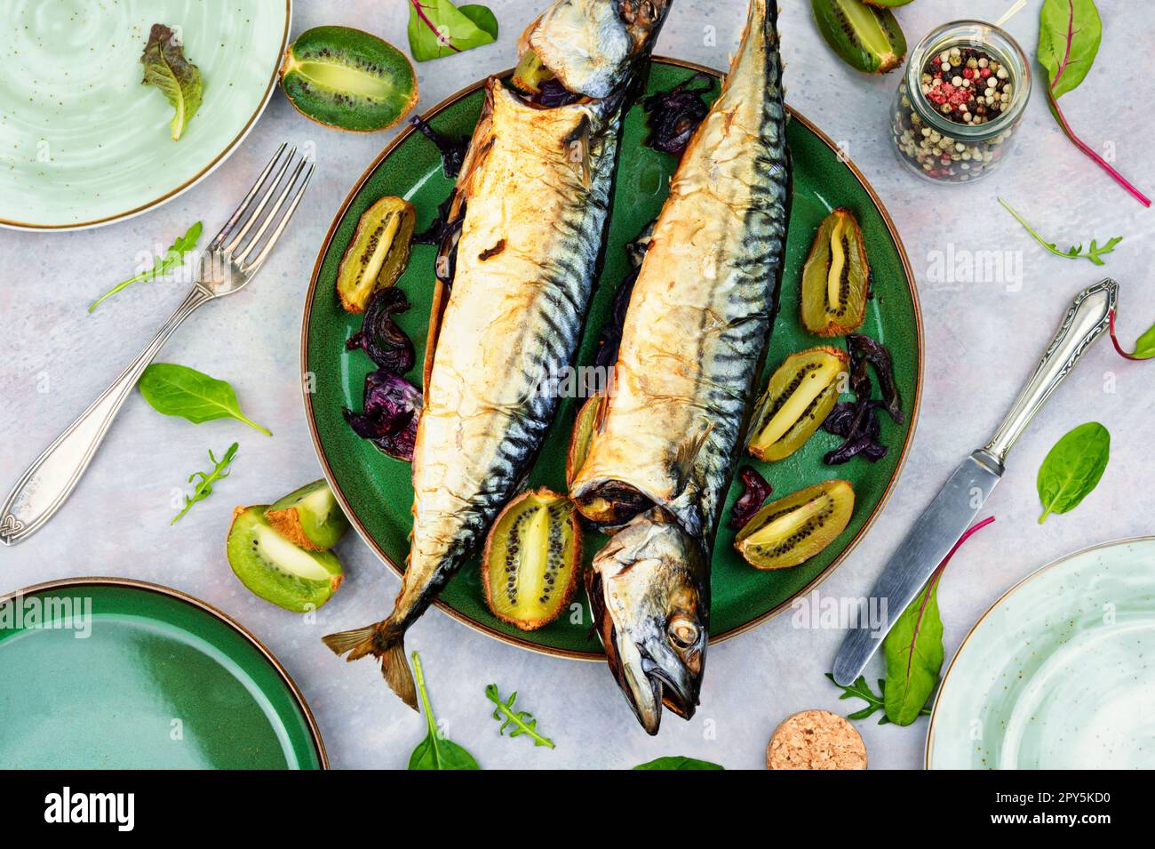 Grilled mackerel fish with kiwi Stock Photo - Alamy