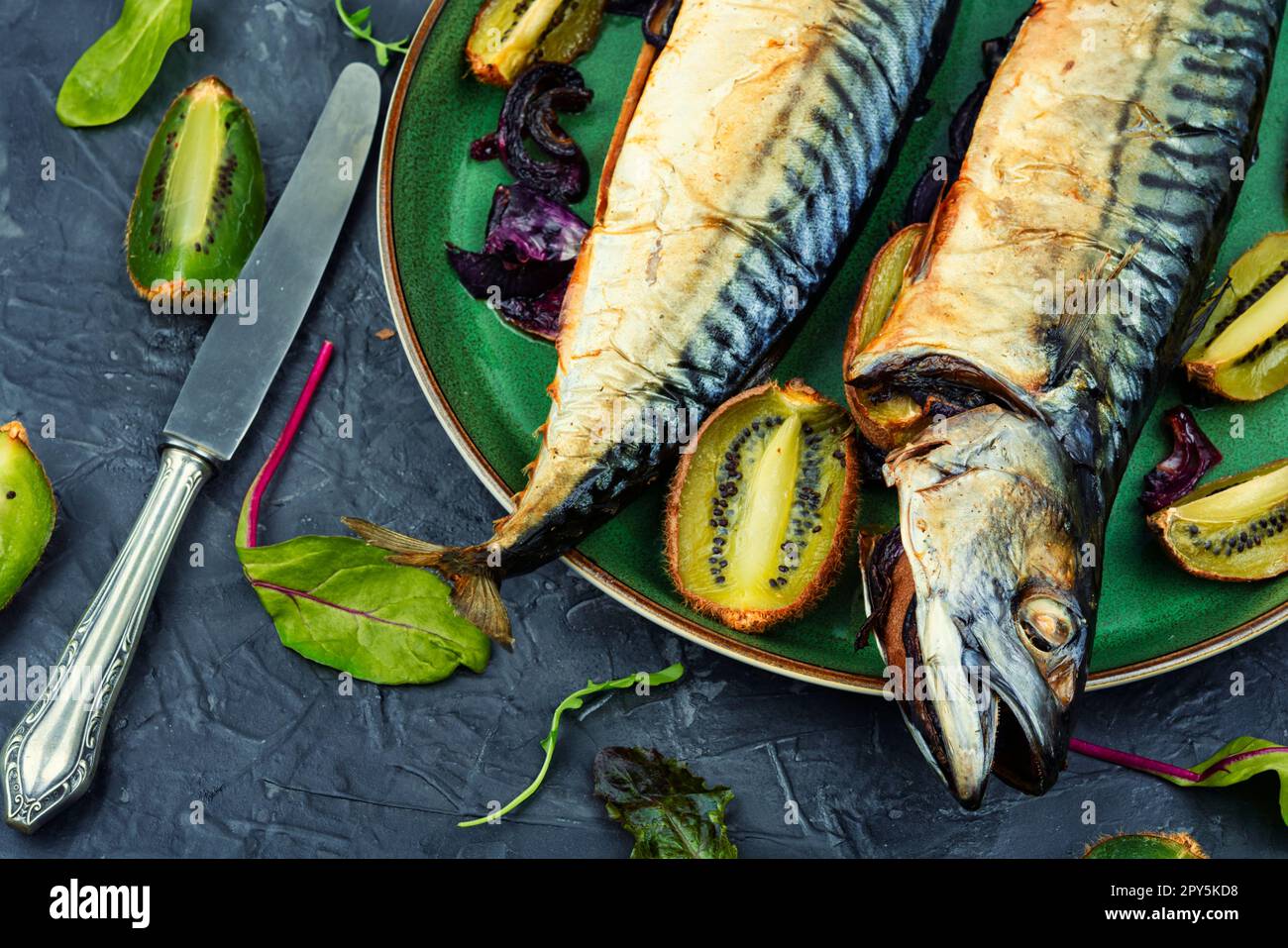 Grilled mackerel fish with kiwi Stock Photo - Alamy