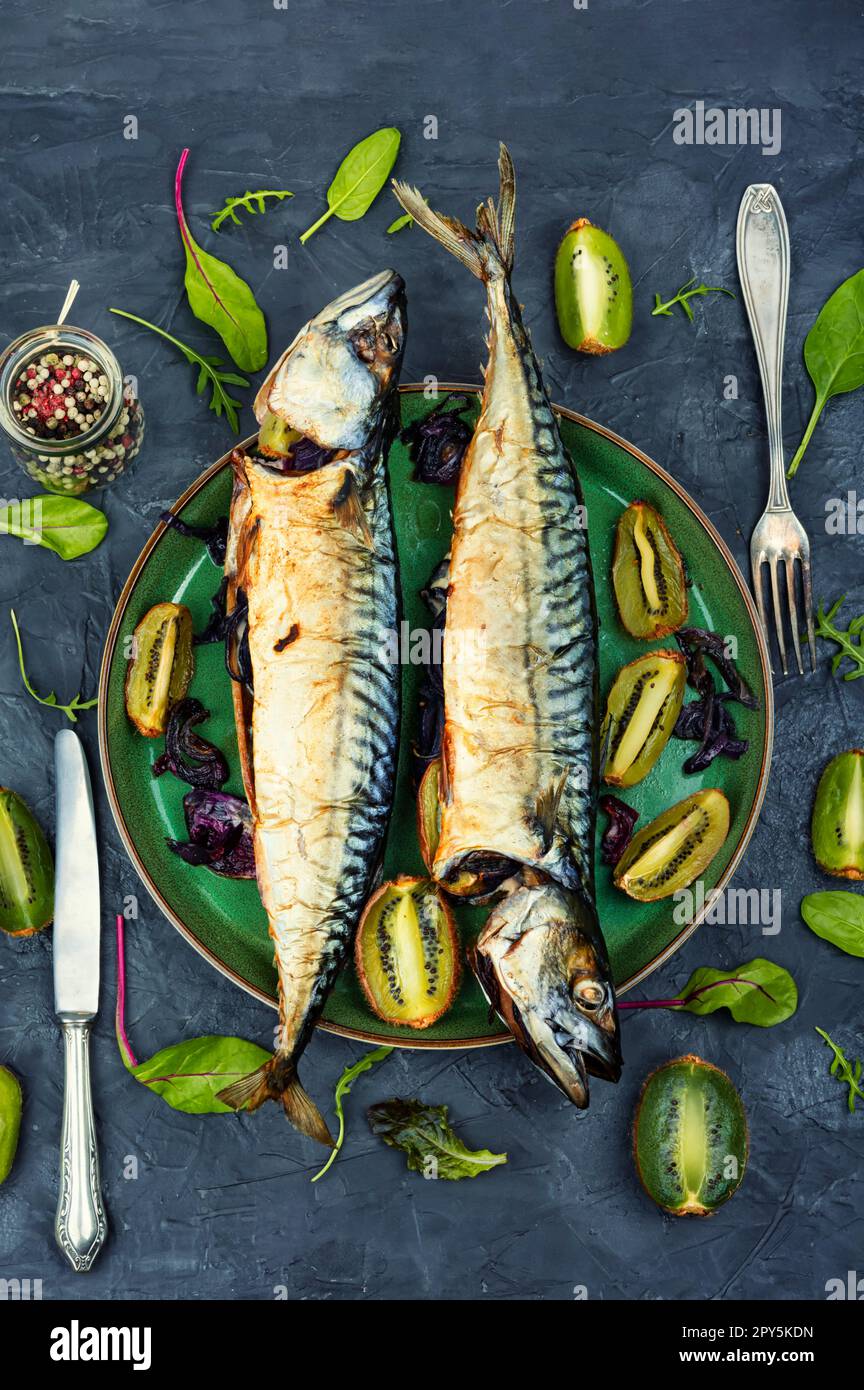 Grilled mackerel fish with kiwi Stock Photo - Alamy