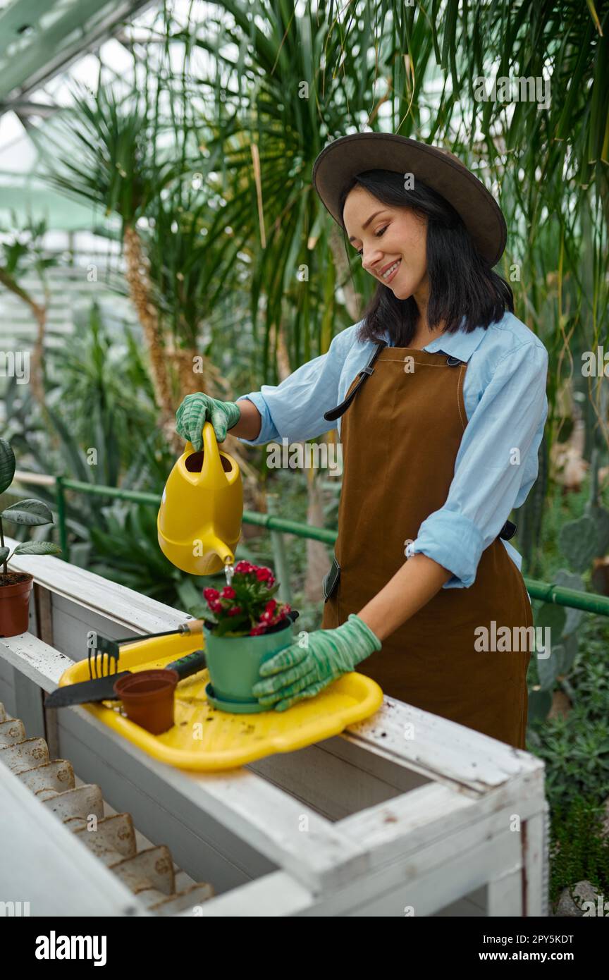 Young smiling female gardener hi-res stock photography and images - Alamy
