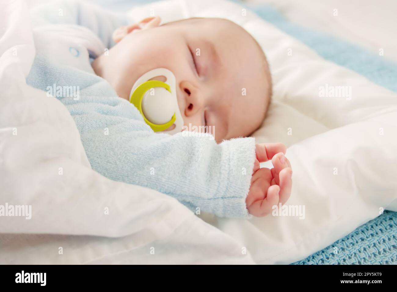 Cute three month old baby sleeping in comfortable bed Stock Photo - Alamy