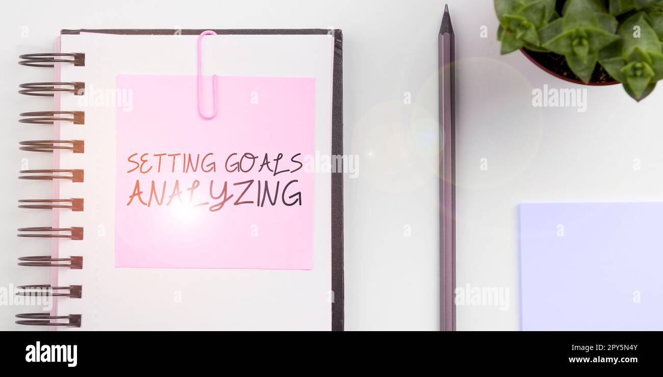 Conceptual caption Setting Goals Analyzing. Business showcase list to ...