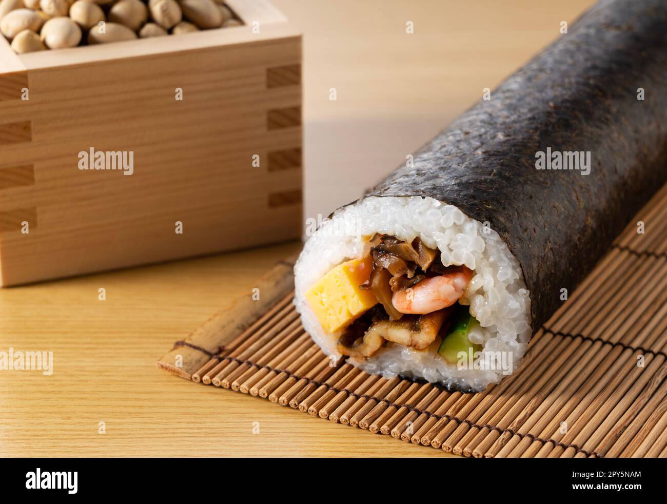 Eho-maki rolls and beans for mame-maki (bean-throwing) on the table ...