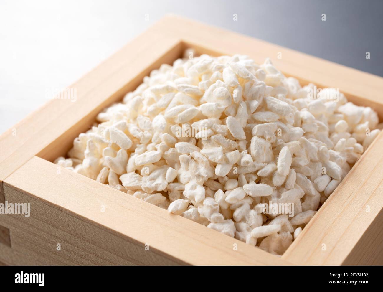 Rice koji in a box set against a black background Stock Photo - Alamy