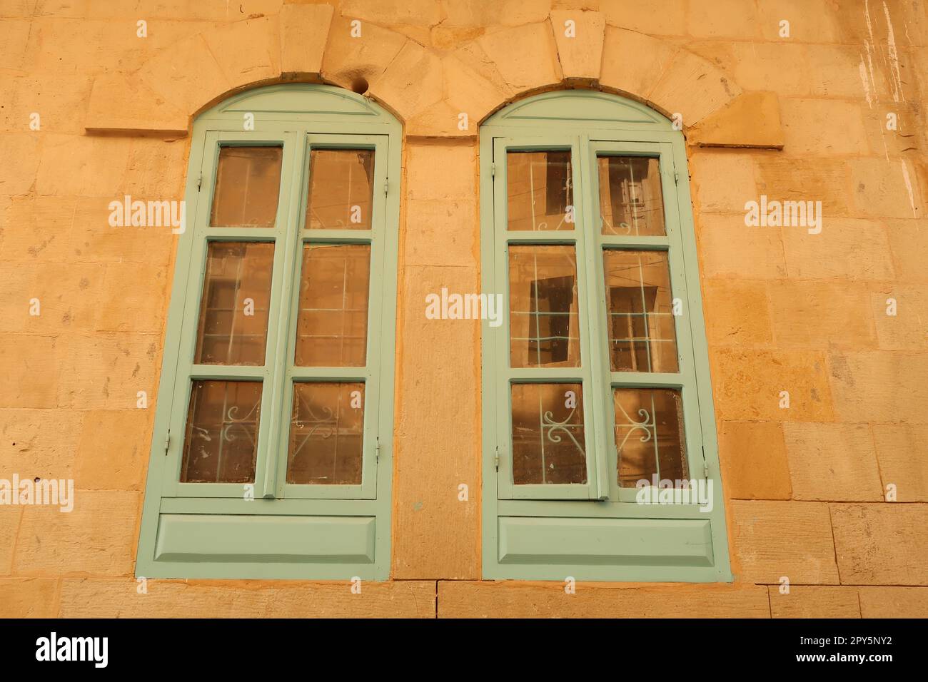 Turquoise, baby blue windows in As-Salt, Salt, Jordan Stock Photo - Alamy
