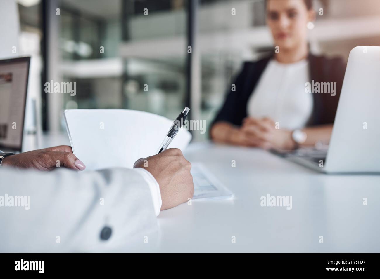 Its time to put pen to paper. an unrecognizable filling out paperwork ...