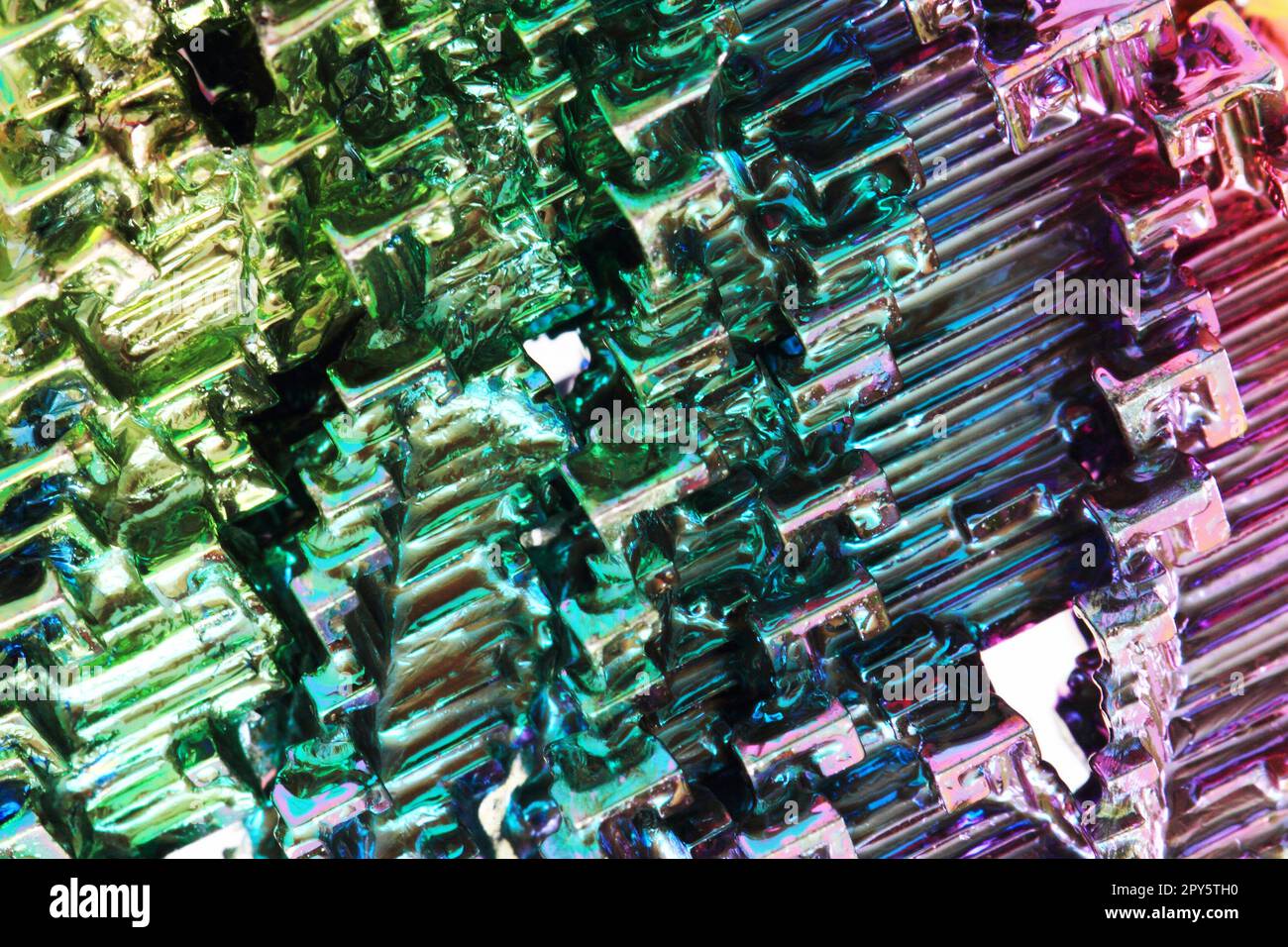 Bismuth - rainbow metal texture as color background Stock Photo - Alamy