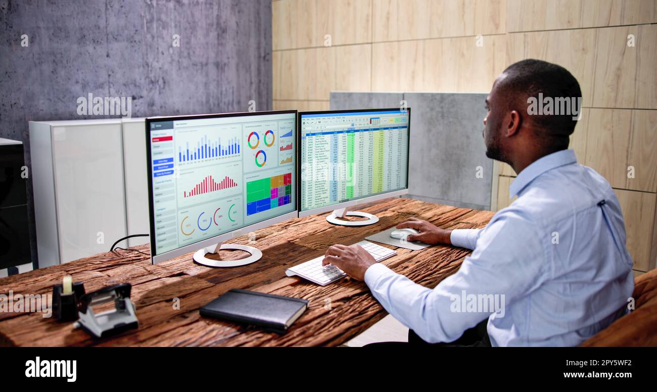 Analyst using spreadsheet report hi-res stock photography and images ...