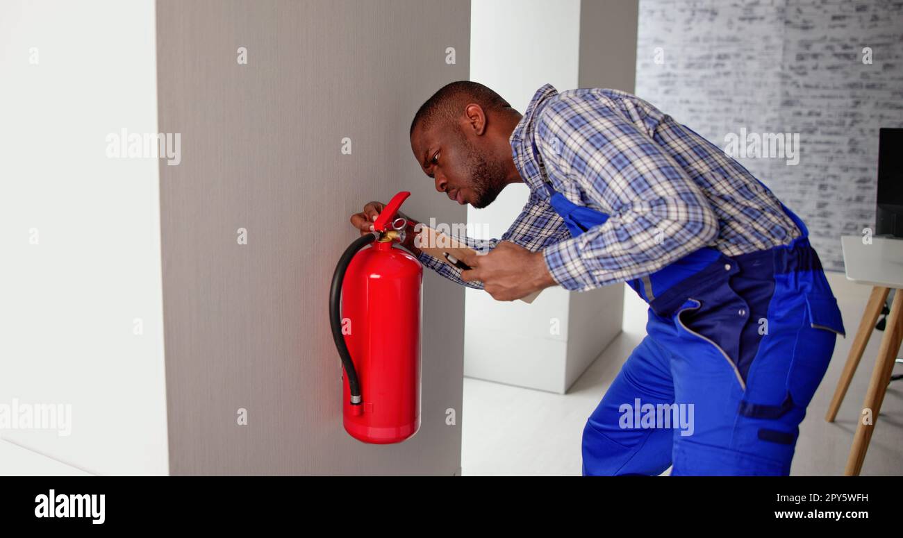 Red fire extinguisher inspection hi-res stock photography and images ...