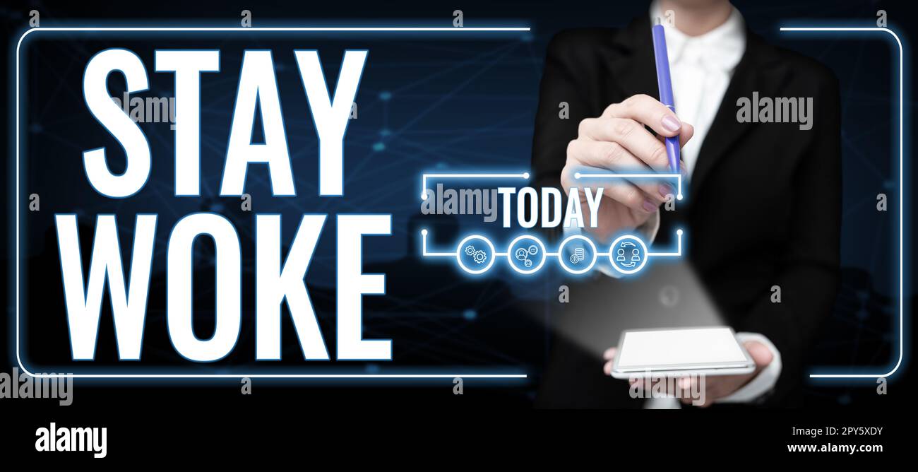 Hand writing sign Stay Woke. Internet Concept being aware of your ...