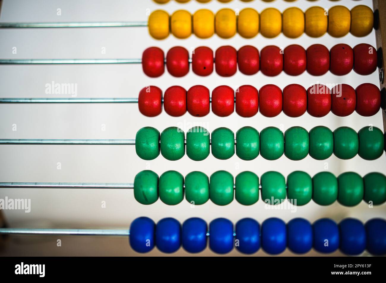 Wooden multi colored abacus Stock Photo - Alamy