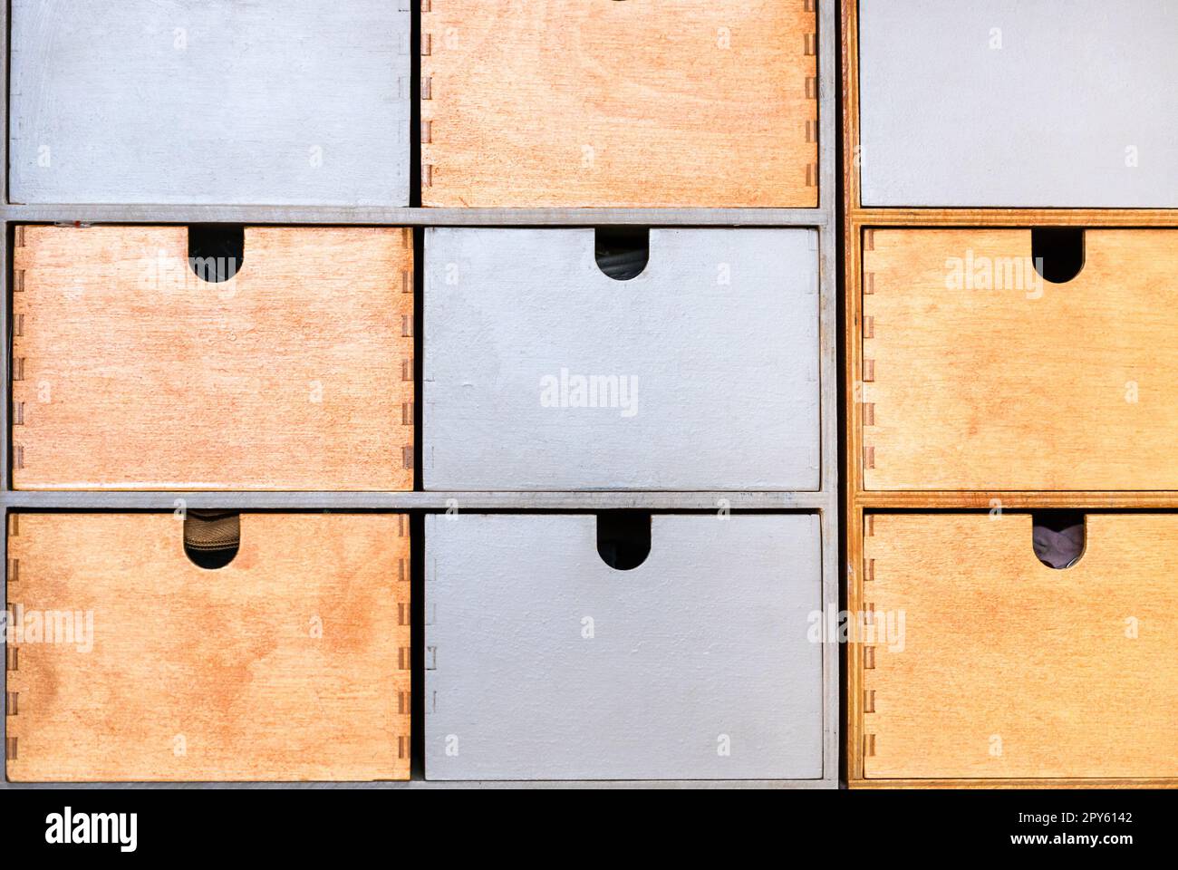 closed wooden drawers for small items in rack Stock Photo - Alamy