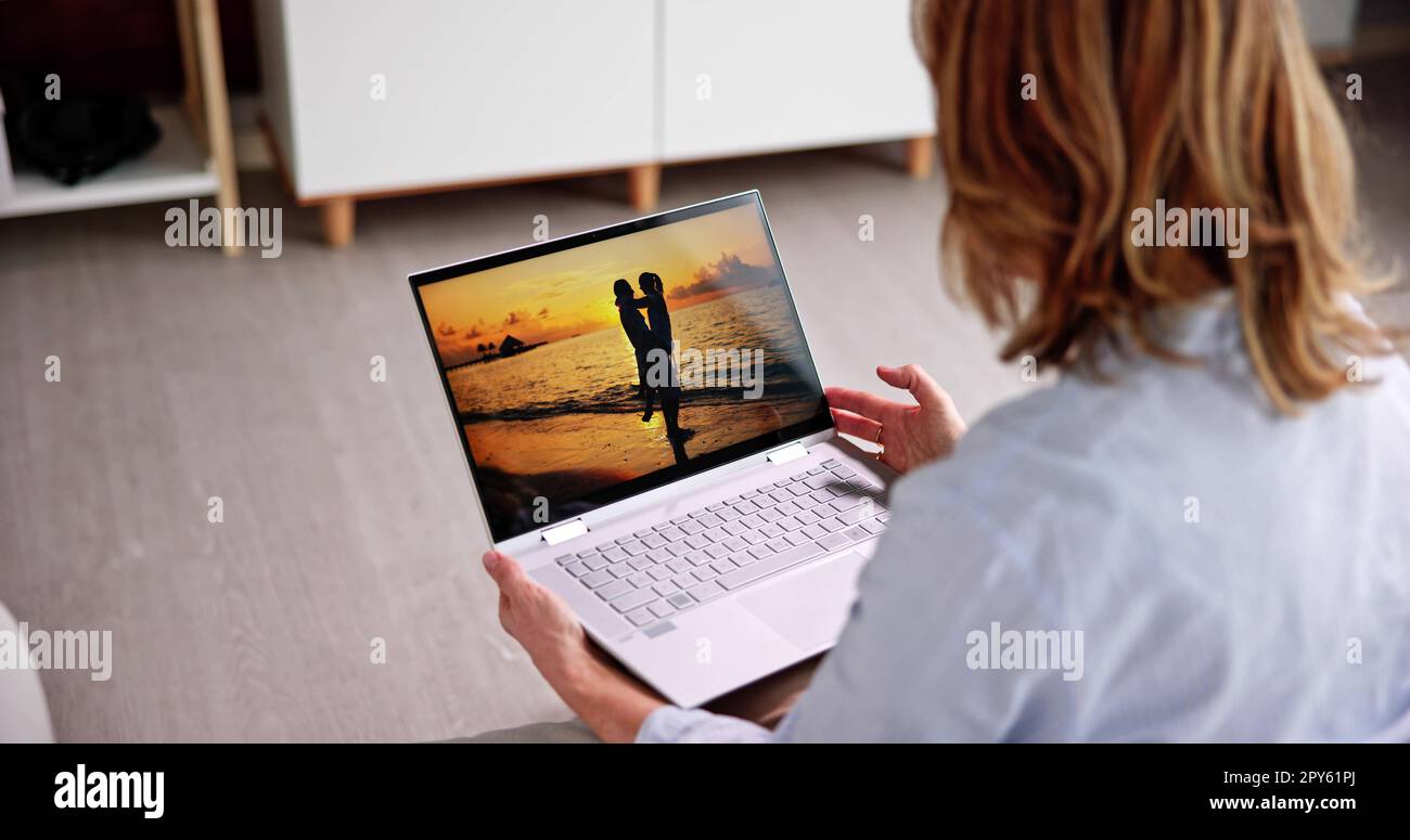 Laptop watching tv hi-res stock photography and images - Alamy
