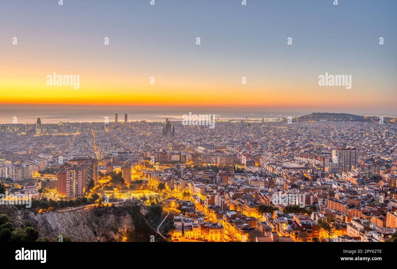 The skyline of Barcelona in Spain before sunrise Stock Photo - Alamy