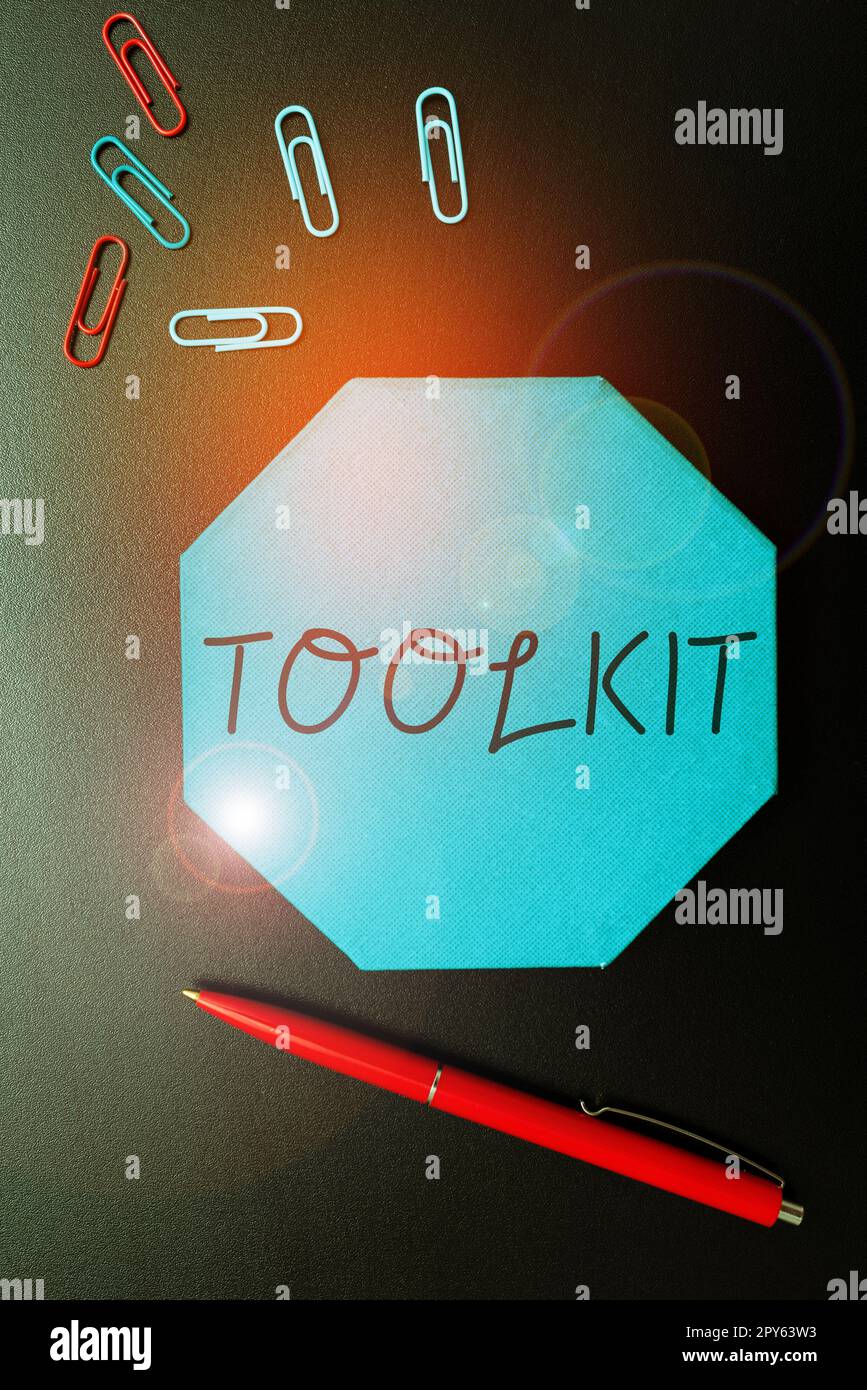 Sign displaying Toolkit. Word Written on set of tools kept in a bag or ...