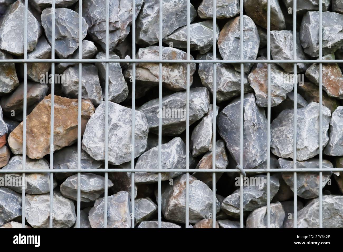 Raw rocks border and gray stones wall as natural stones background with ...