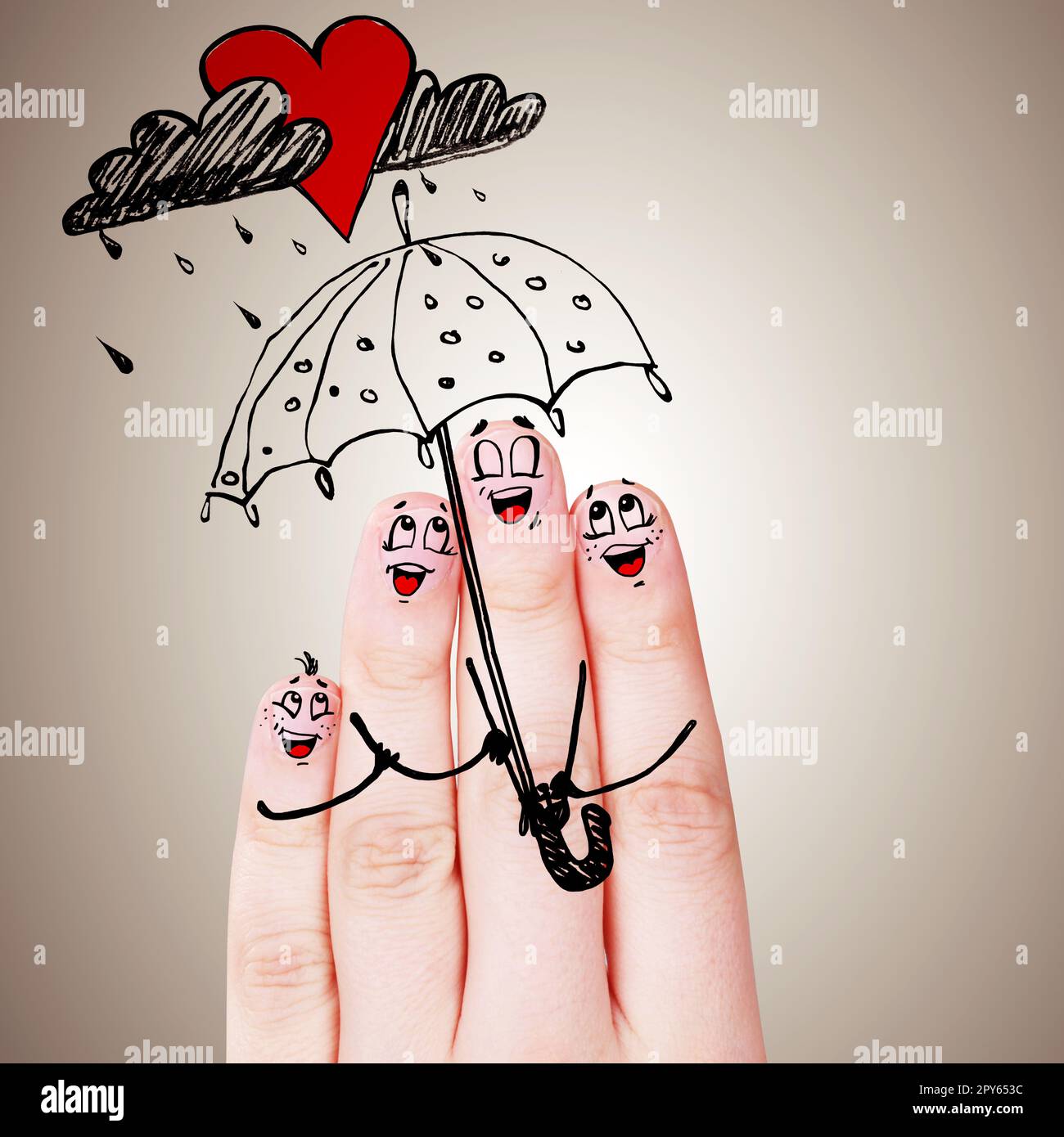 Finger puppets of loving parents with young child hugging and having ...