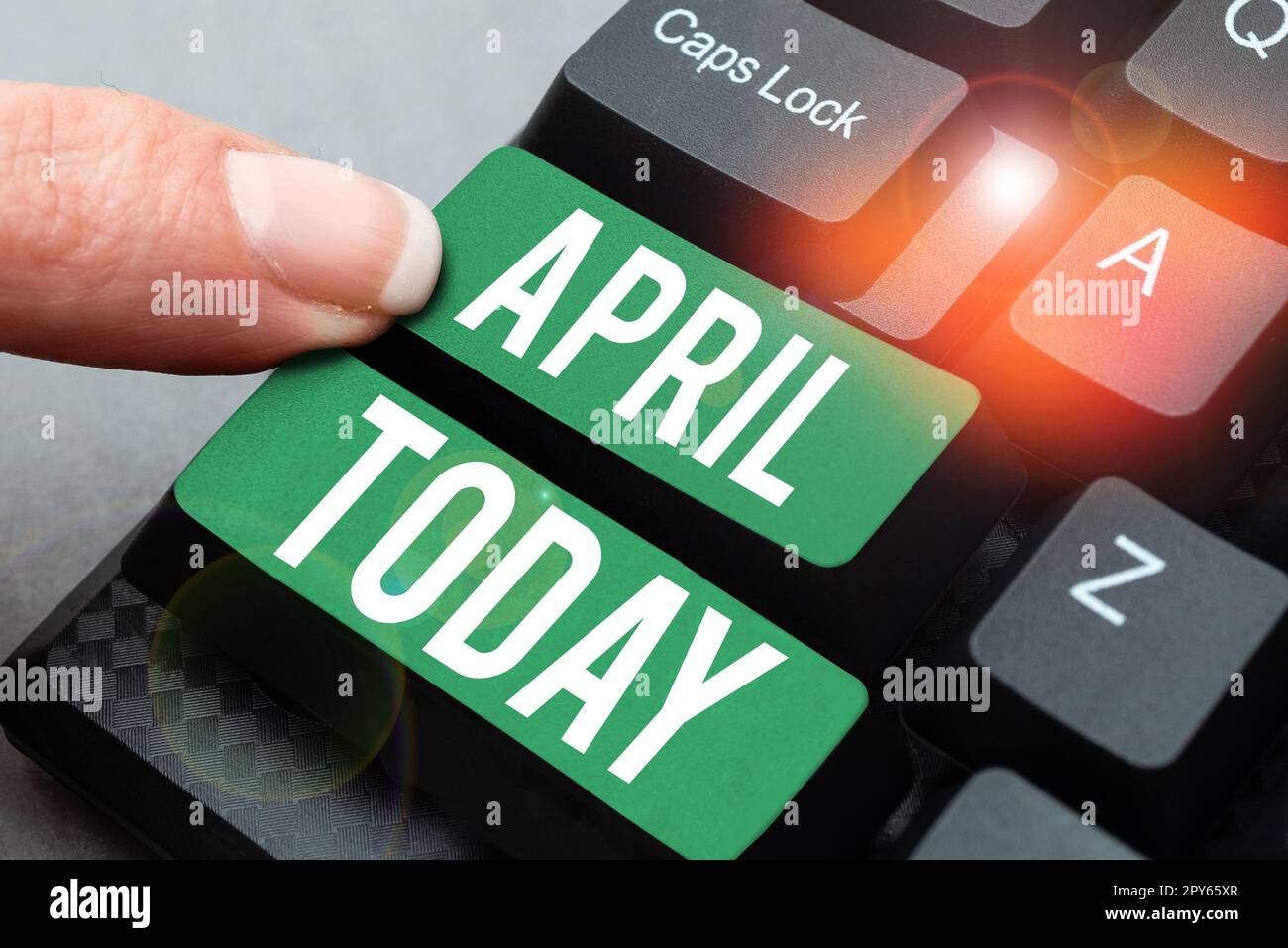 Text sign showing April. Concept meaning Opening buds of the flowers of ...