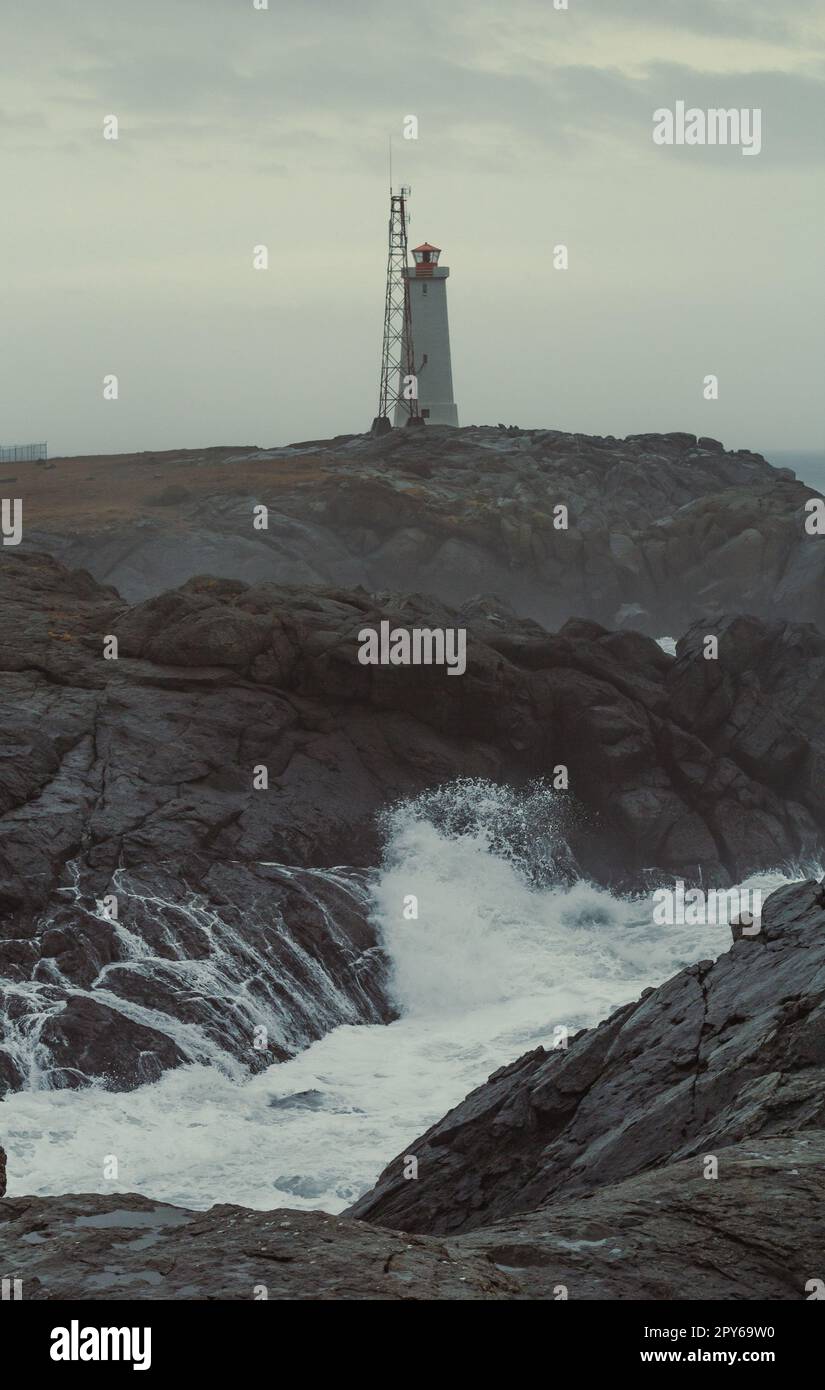 Lighthouse landmark on rocky coast landscape photo Stock Photo - Alamy