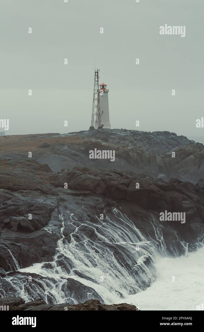Beacon on steep cliff at storm landscape photo Stock Photo - Alamy