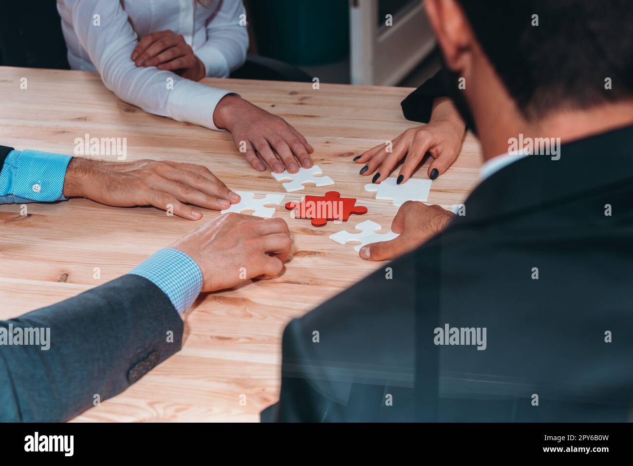 Business team connect pieces of puzzle like a teamwork and partners ...