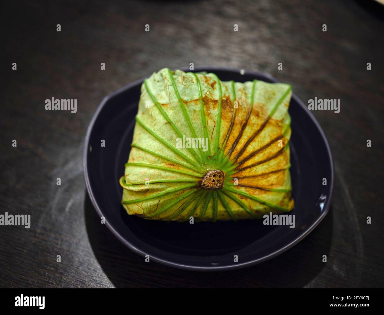 Rice Wrapped in Lotus Leaves . Thai food Stock Photo - Alamy
