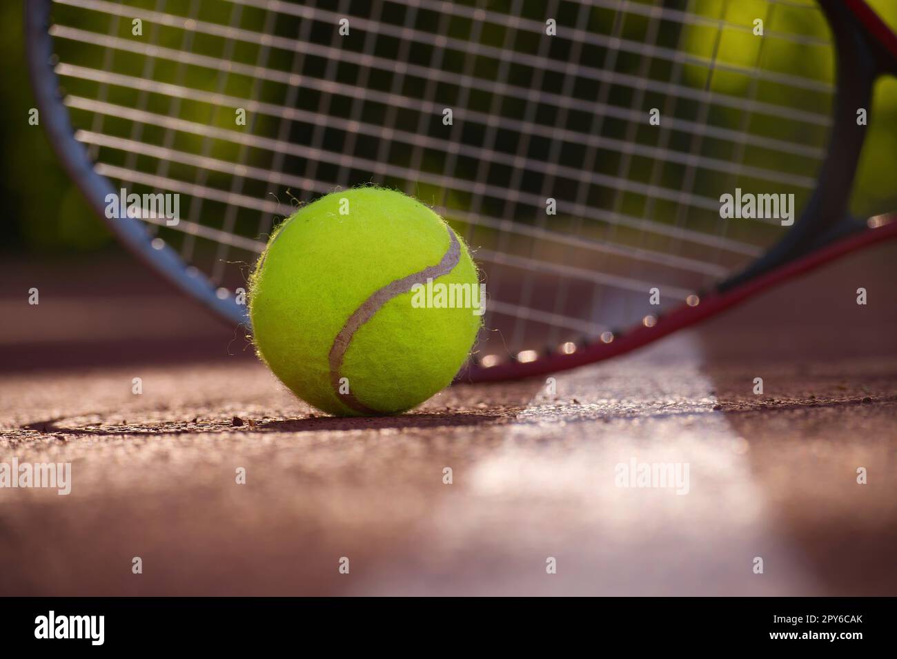 Tennis ball, racquet and hard court surface corner line Stock Photo - Alamy