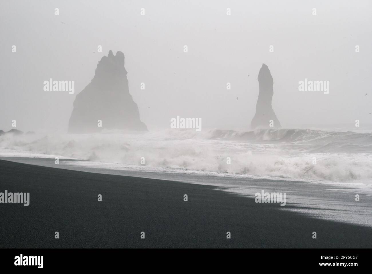 Dark cliffs in stormy sea monochrome landscape photo Stock Photo - Alamy
