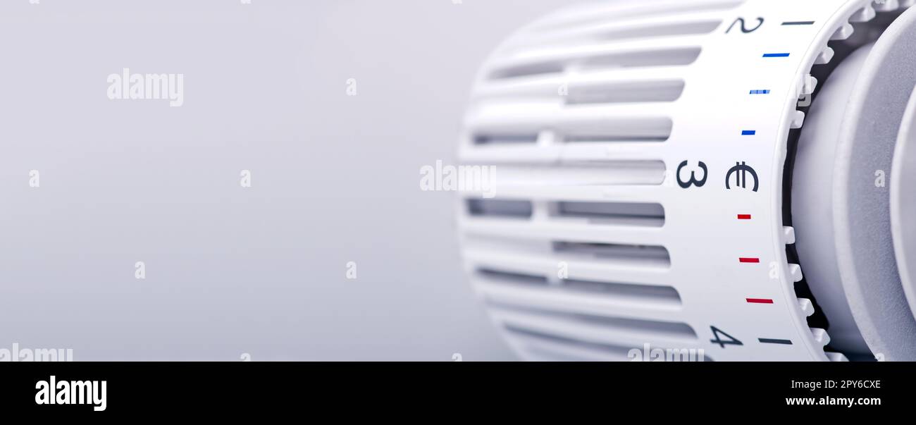 Thermostat of an heating radiator with Euro symbol, rising costs for ...