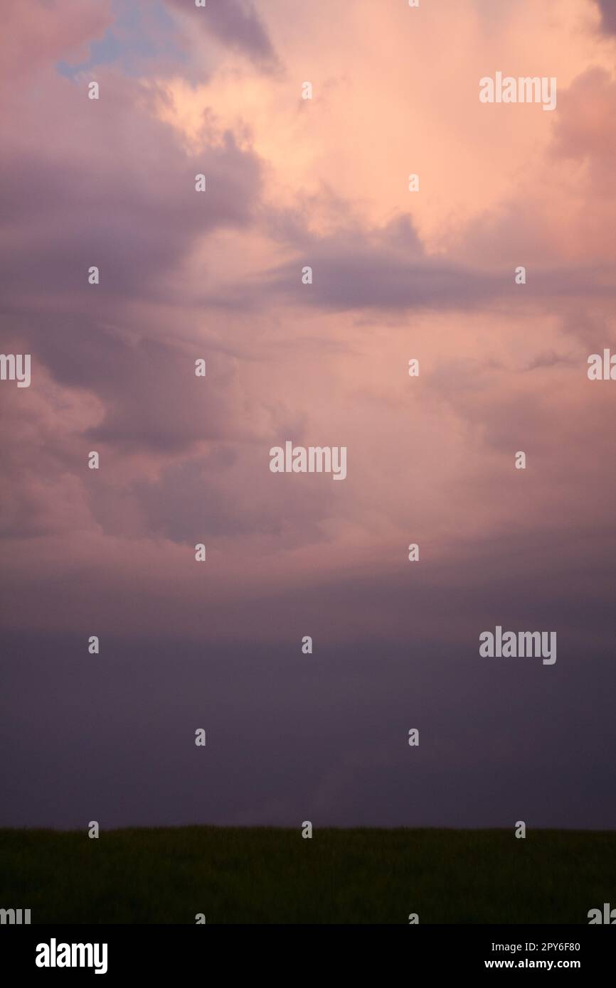 Pink sky fluffy clouds hi-res stock photography and images - Alamy