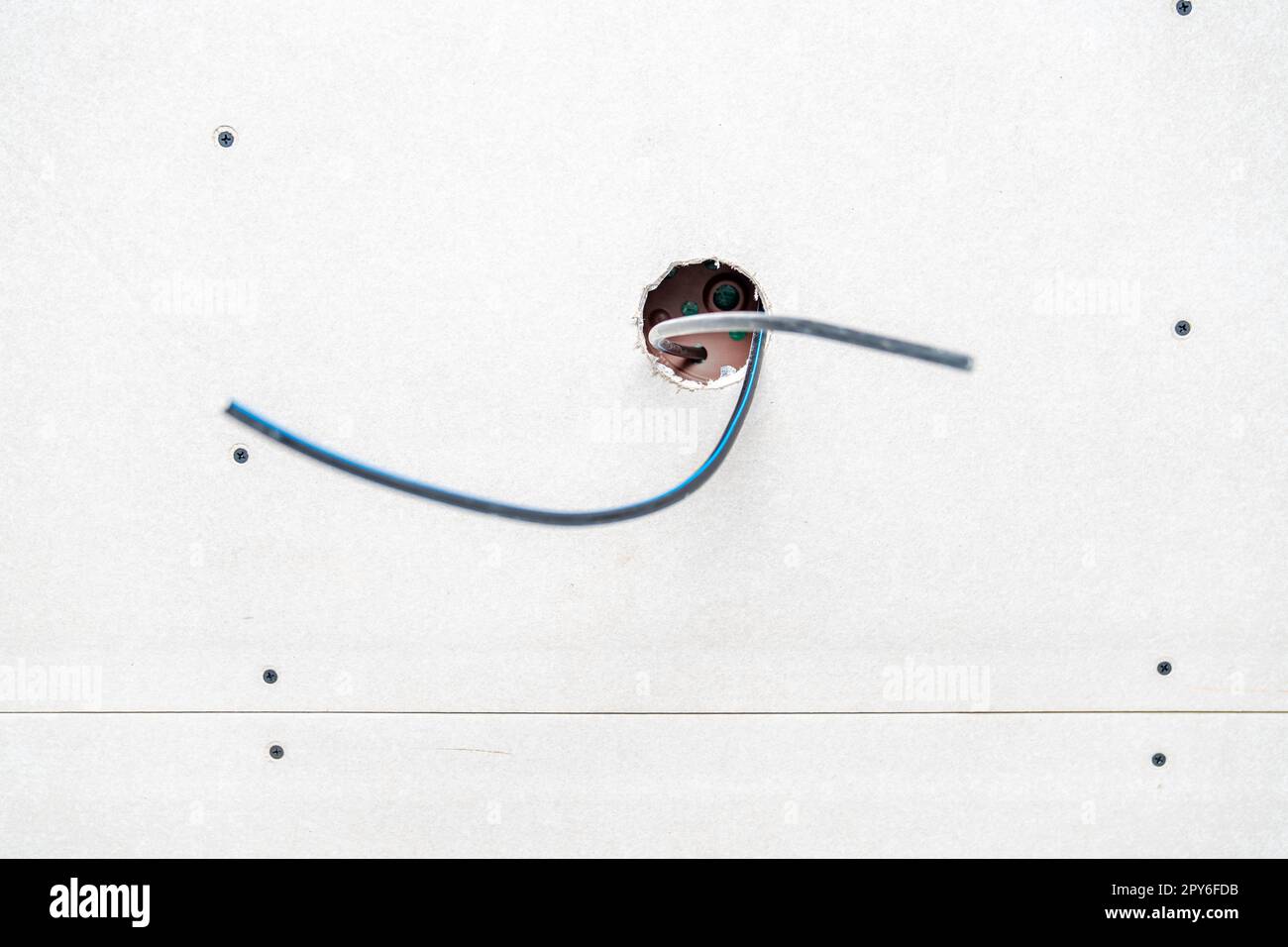 wires in the hole in the ceiling to connect the light Stock Photo - Alamy