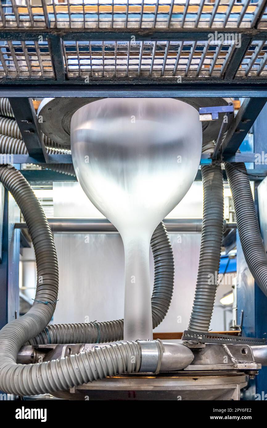 blowing plastic on a machine into a roll for the production of plastic ...