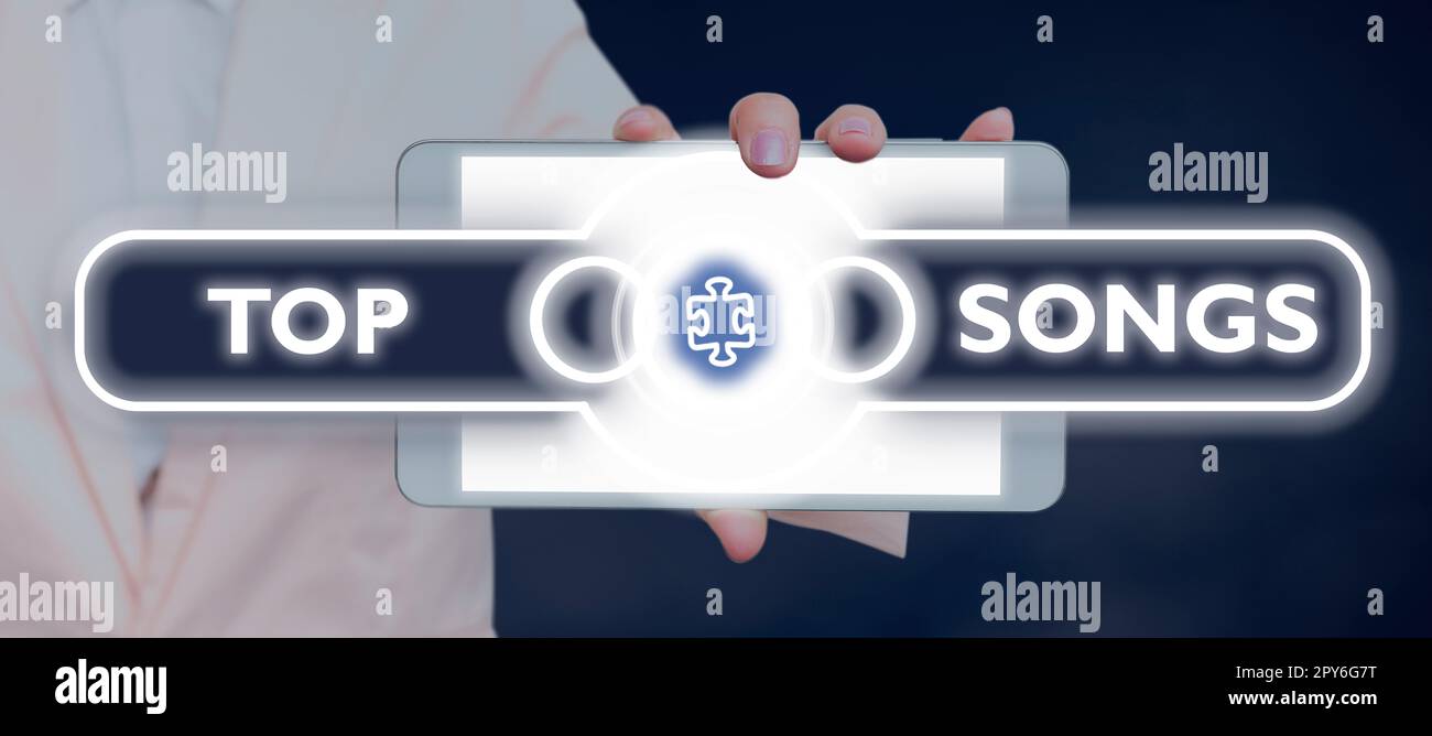 Sign displaying Top Songs. Word Written on recorded song that becomes ...