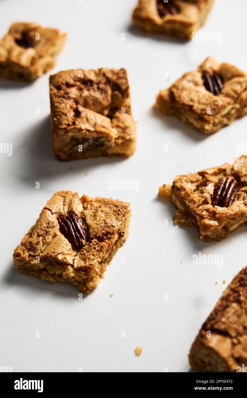 blondie cookies squares on white marble countertop background. White ...