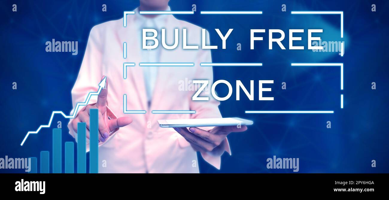 Hand writing sign Bully Free Zone. Word Written on Be respectful to ...