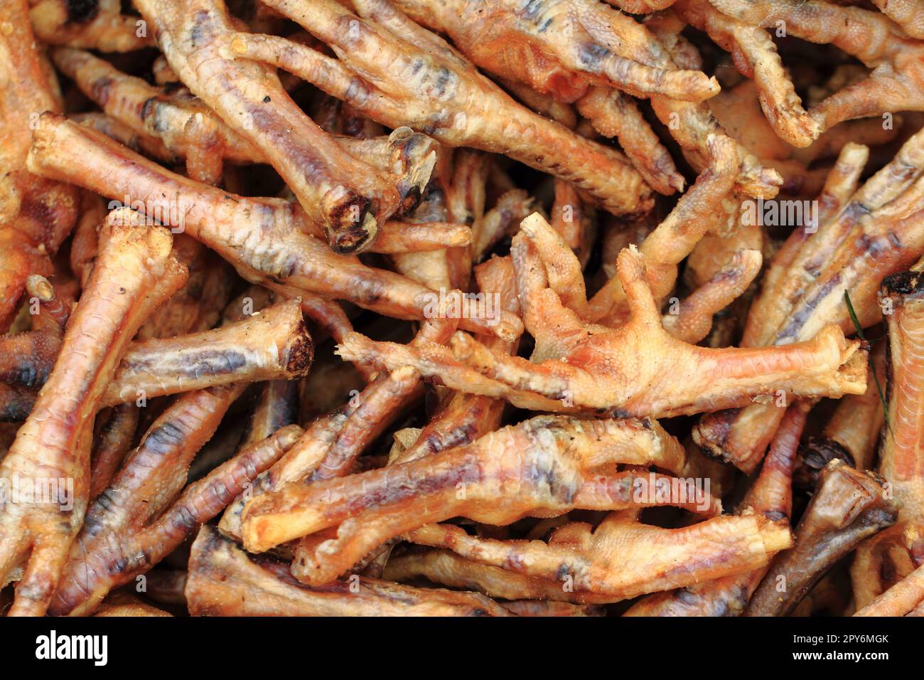 chicken claw texture as dog food background Stock Photo - Alamy