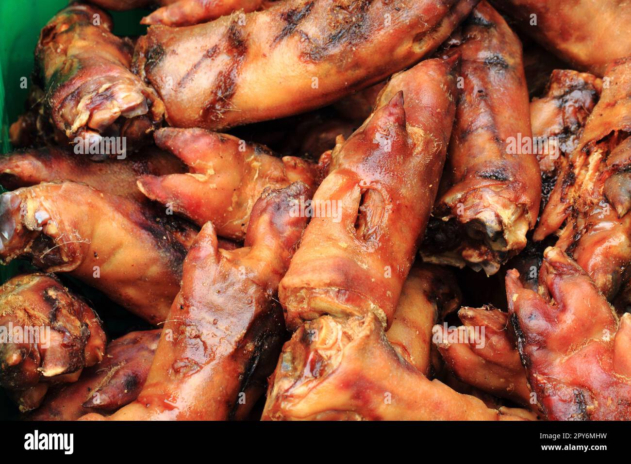 smoked pig legs texture as food for dogs Stock Photo - Alamy