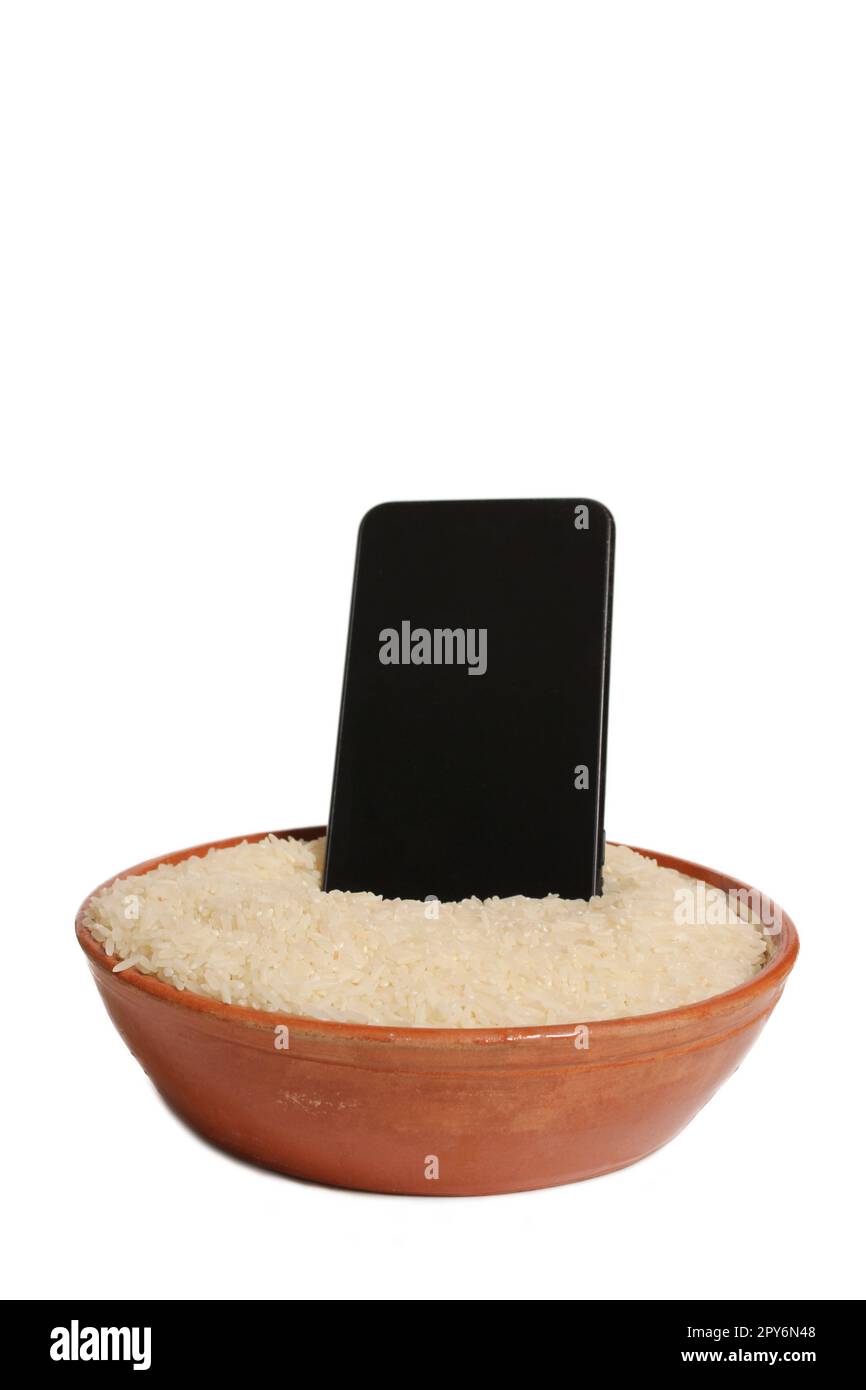 Smartphone in Bowl of White Rice to Remove Water From Phone Stock Photo ...