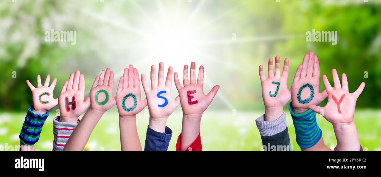Children Hands Building Word Choose Joy, Grass Meadow Stock Photo - Alamy