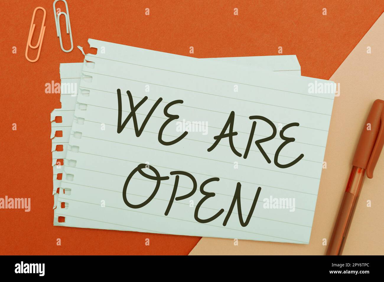 Sign displaying We Are Open. Concept meaning no enclosing or confining ...