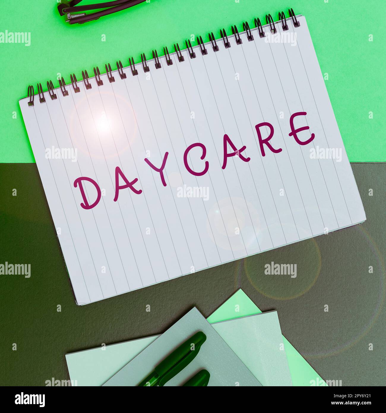 Hand writing sign Daycare. Business idea offering care to preschool ...