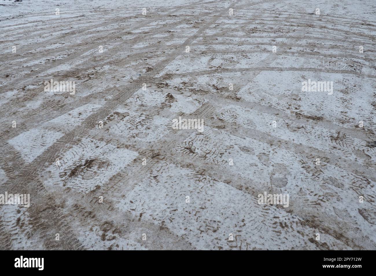 Snow, ice, slush and winter mud at a pedestrian crossing. The air ...