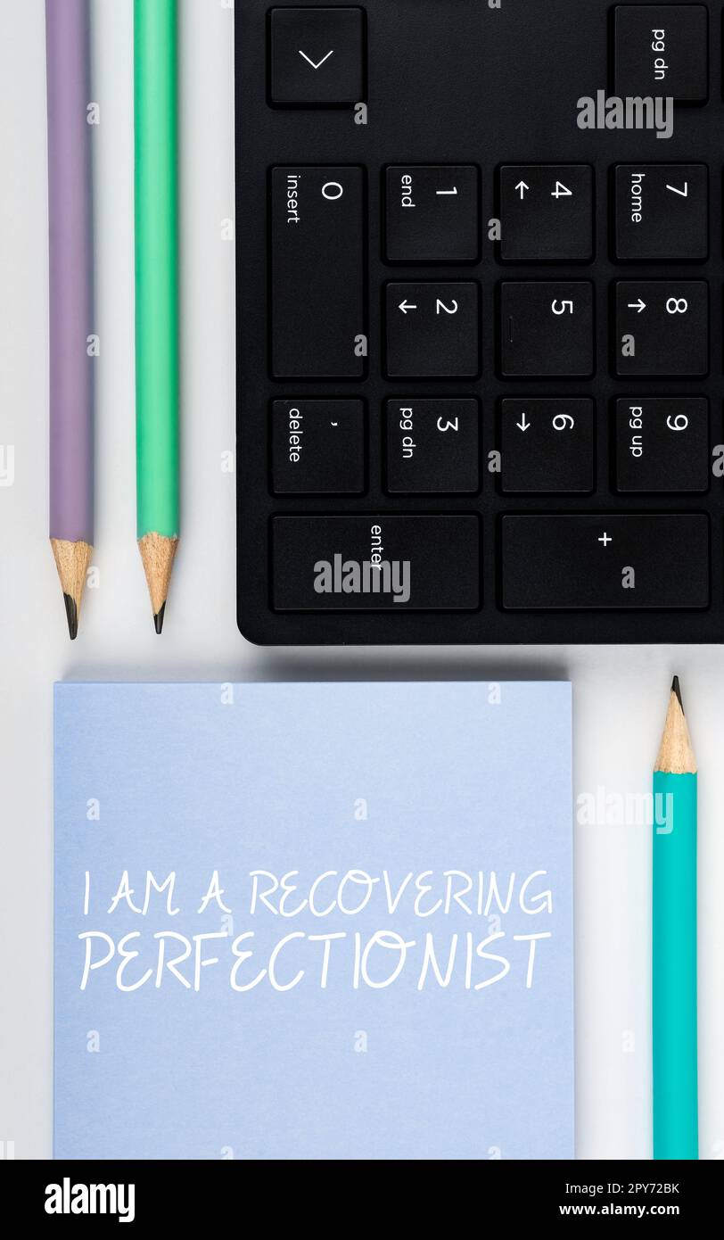 Hand writing sign I Am A Recovering Perfectionist. Word Written on ...