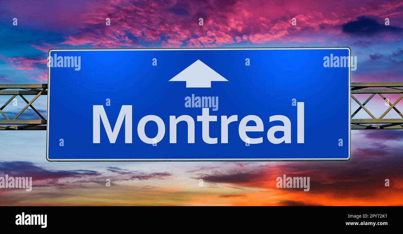 Road sign indicating direction to the city of Montreal Stock Photo - Alamy