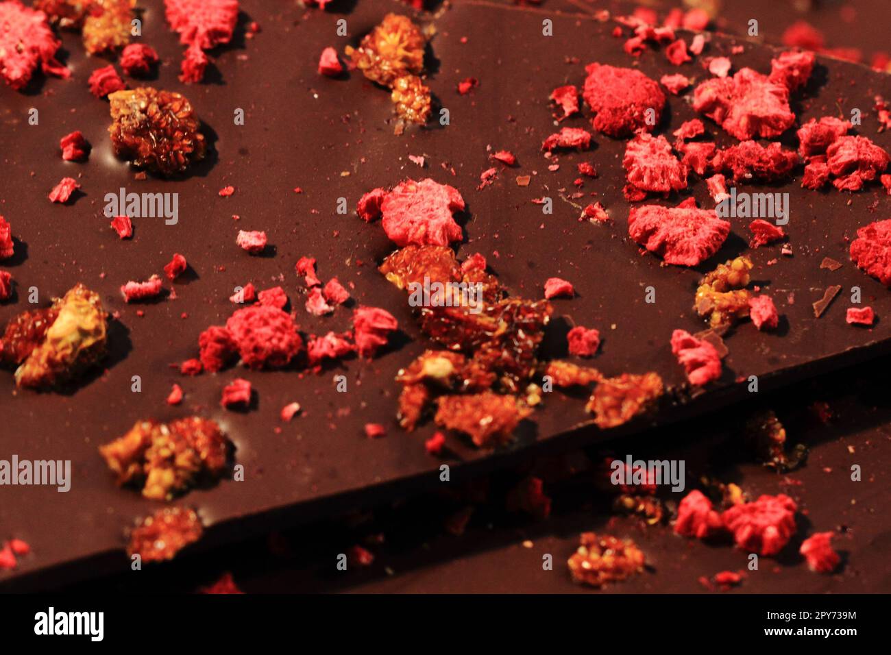 chocolate with nuts and raspberries as sweet food background Stock ...