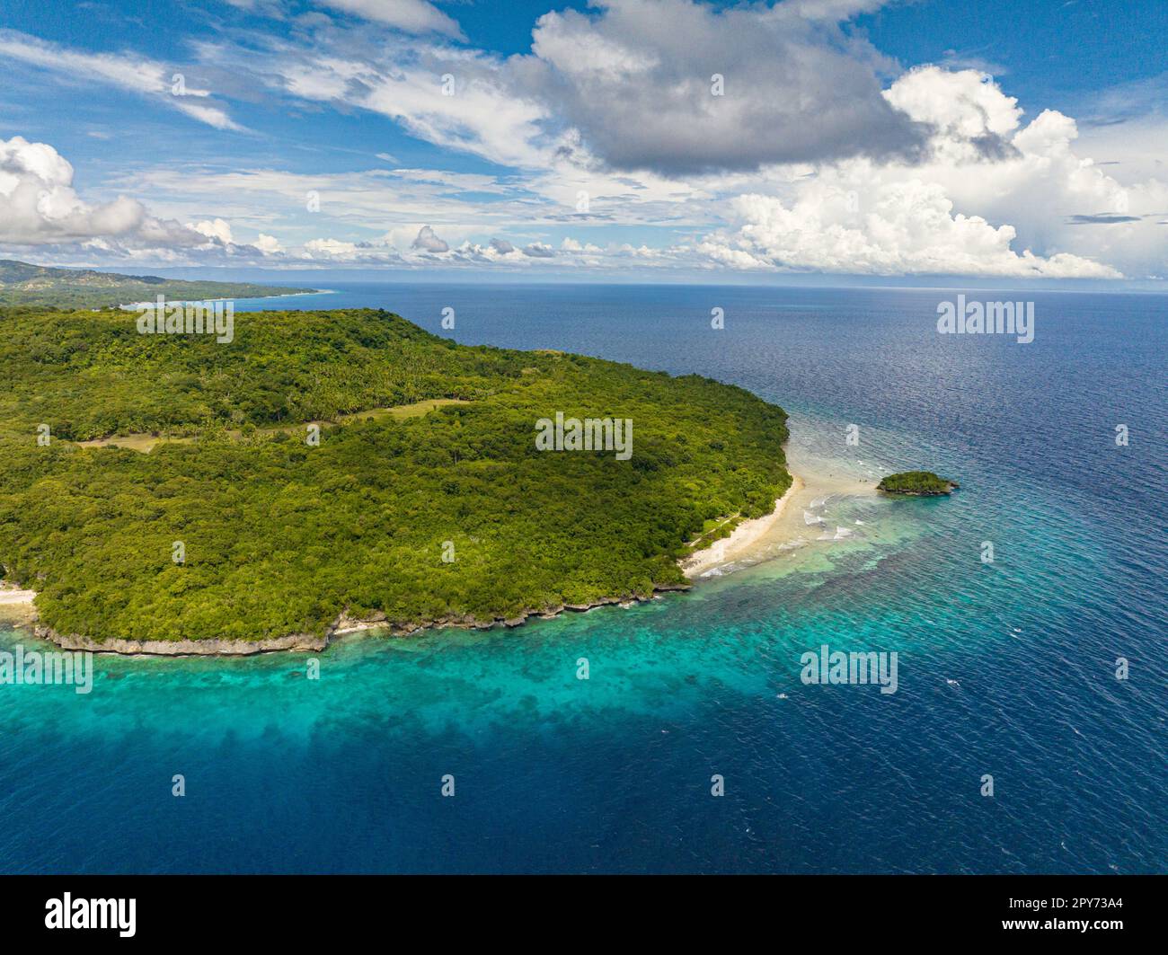 Flying above the Beautiful Tropical Island with a tiny Island near the ...