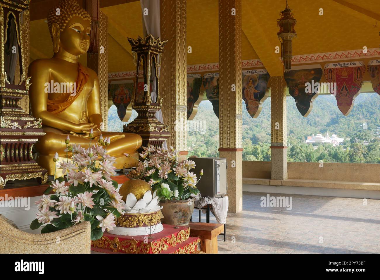 Seated golden buddha statue in temple at Tha Ton, Thailand Stock Photo ...