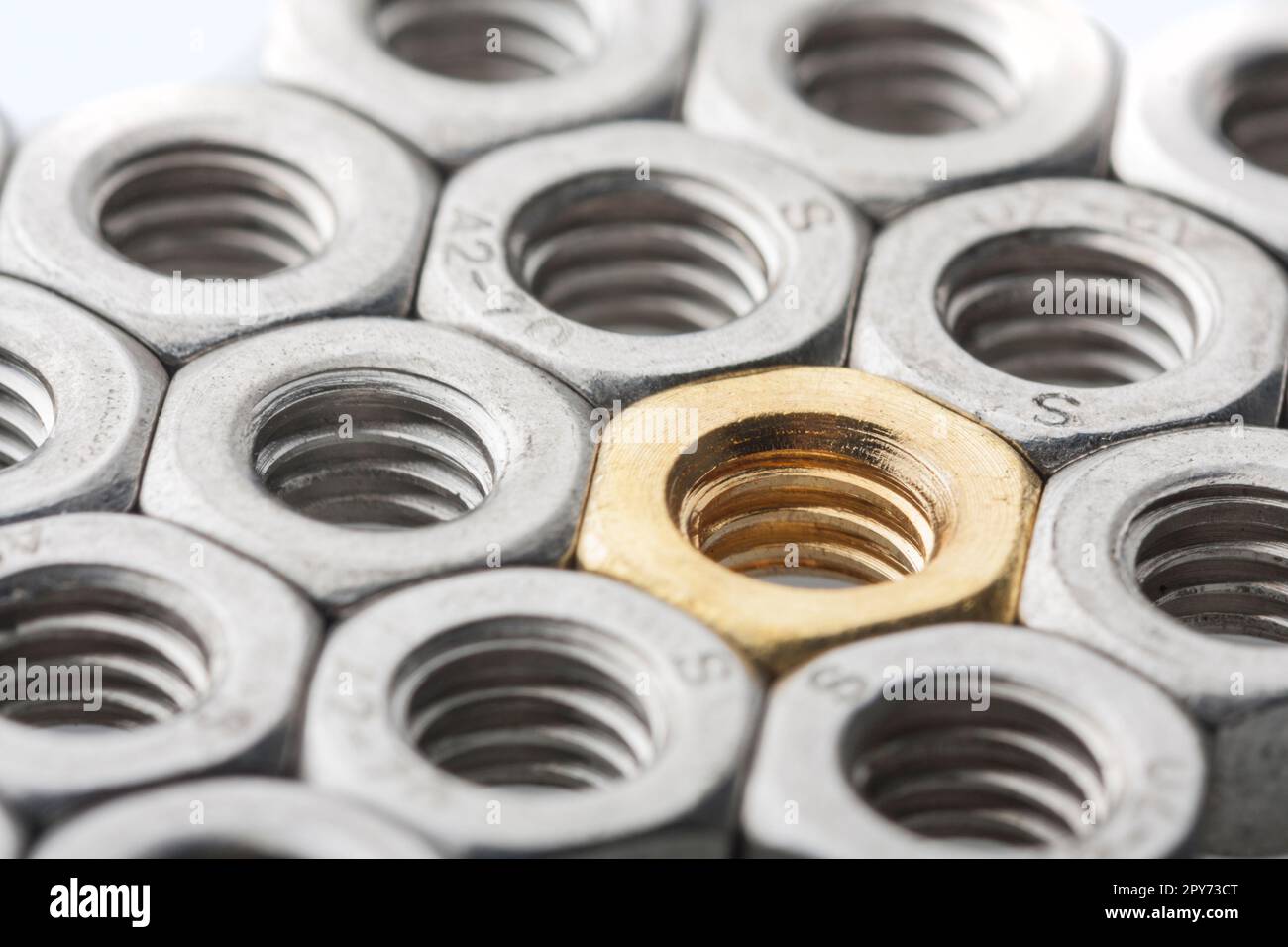 Metallic hex nuts layed out in a hexagonal pattern Stock Photo - Alamy
